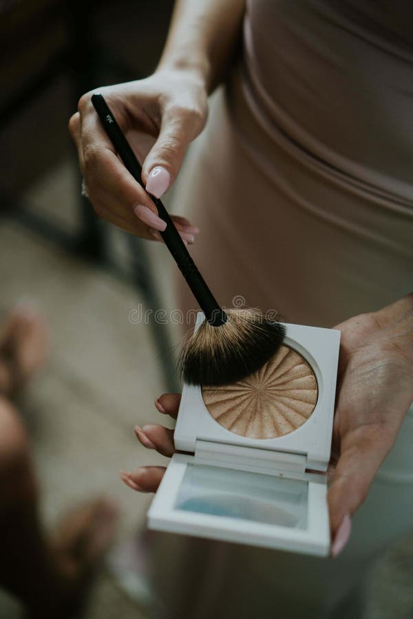 Vertical High Angle Shot of a Woman Using Highlighter Makeup Stock ...