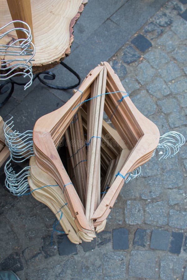 Vertical High Angle Shot of Wooden Cloth Hangers on Each Other on the ...