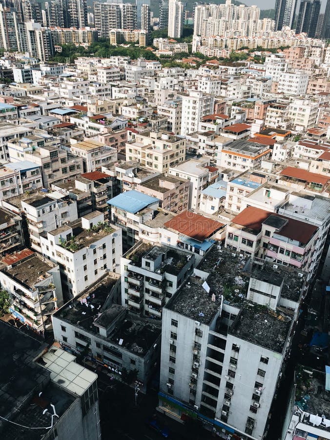 Vertical High Angle View of a City Covered in Buildings Under the ...