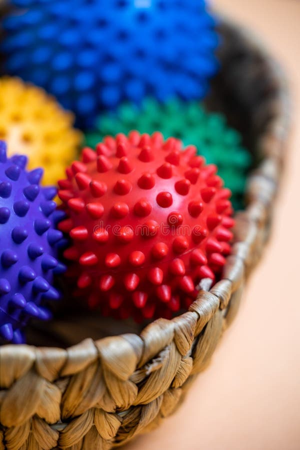 Vertical High-angle View of Colorful Spikey Balls in a Basket Stock ...