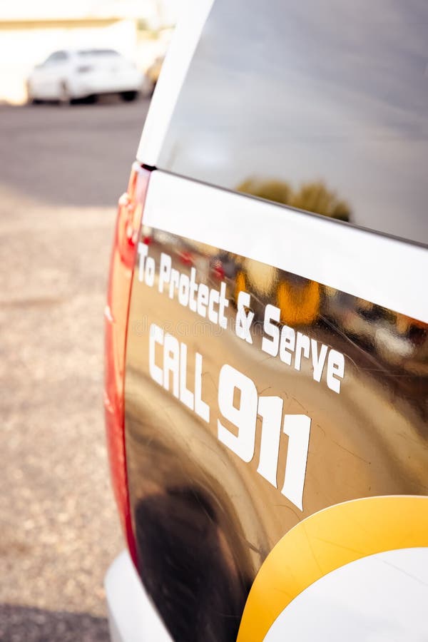 Vertical Image of Back End of a Police Car Vehicle Reading Protect and ...