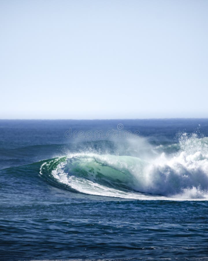 Vertical Image of an Breaker Wave Crashing into the Ocean Stock Photo ...