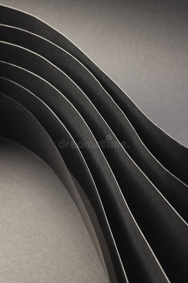 Vertical Image of Close Up of Rolled Up Pieces of Black Paper with Copy ...
