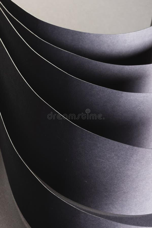 Vertical Image of Close Up of Rolled Up Pieces of Black Paper with Copy ...