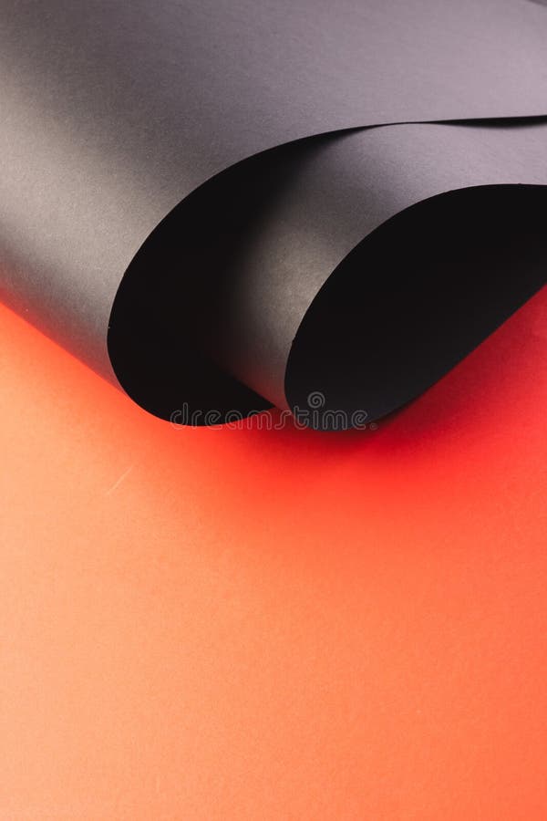 Vertical Image of Close Up of Rolled Up Pieces of Black Paper with Copy ...
