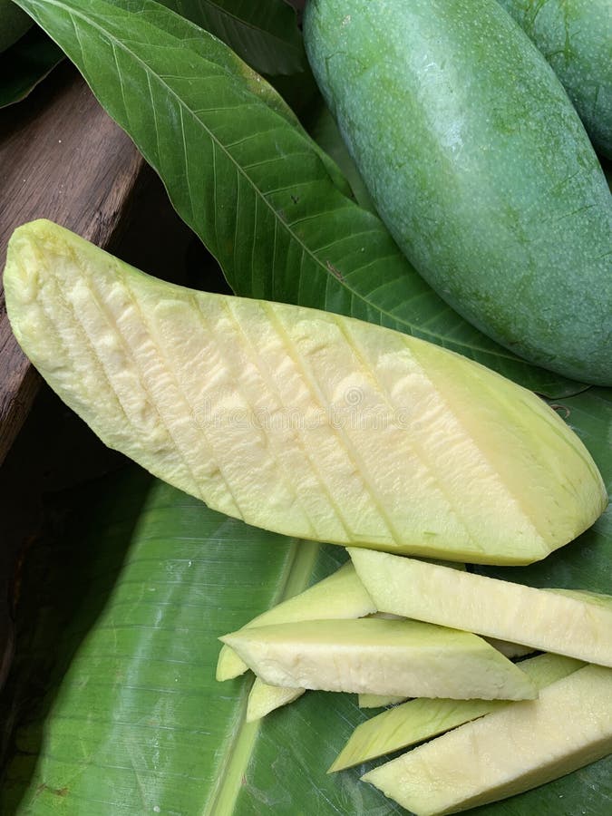 The Vertical Image of Fresh Peeled Mango Stock Image - Image of leaves ...