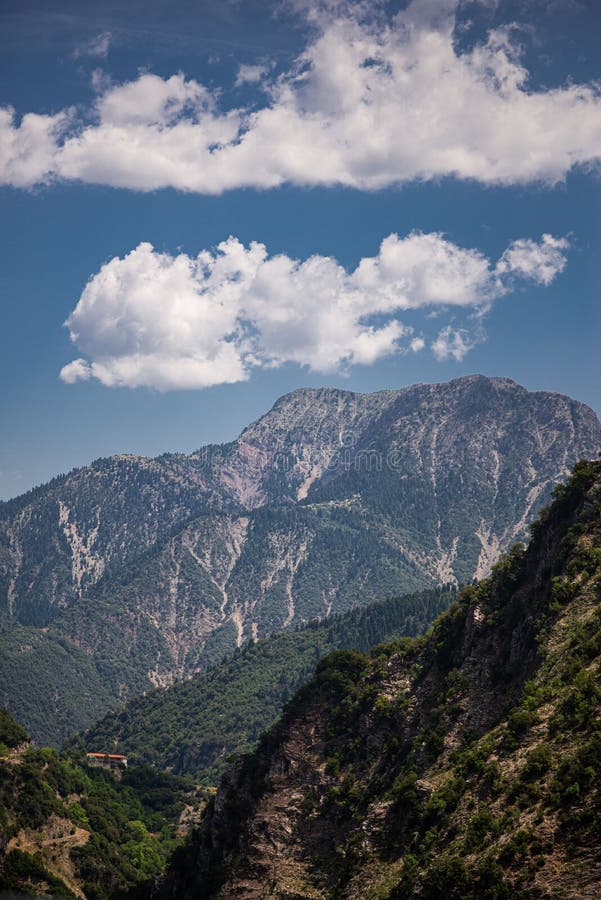 Vertical Image of Green Covered Mountains with Beautiful Sky during ...