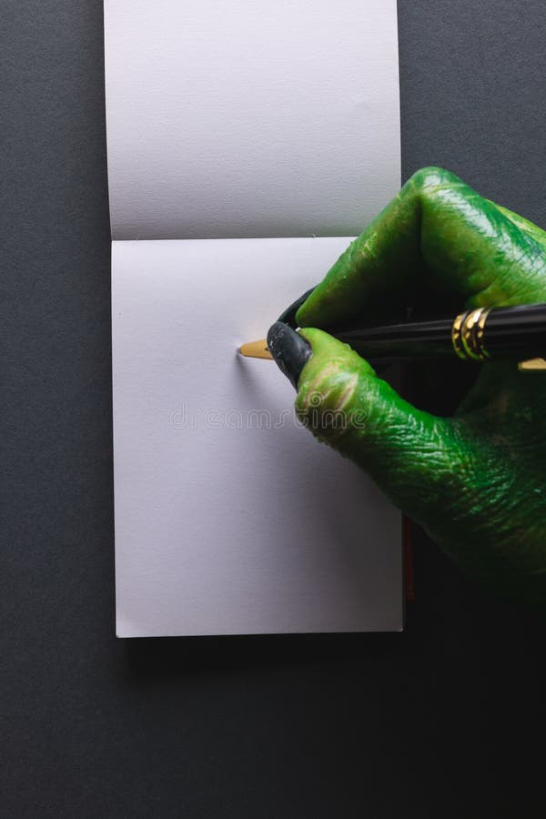 Vertical Image of Green Monster Hands Writing Notebook with Copy Space ...