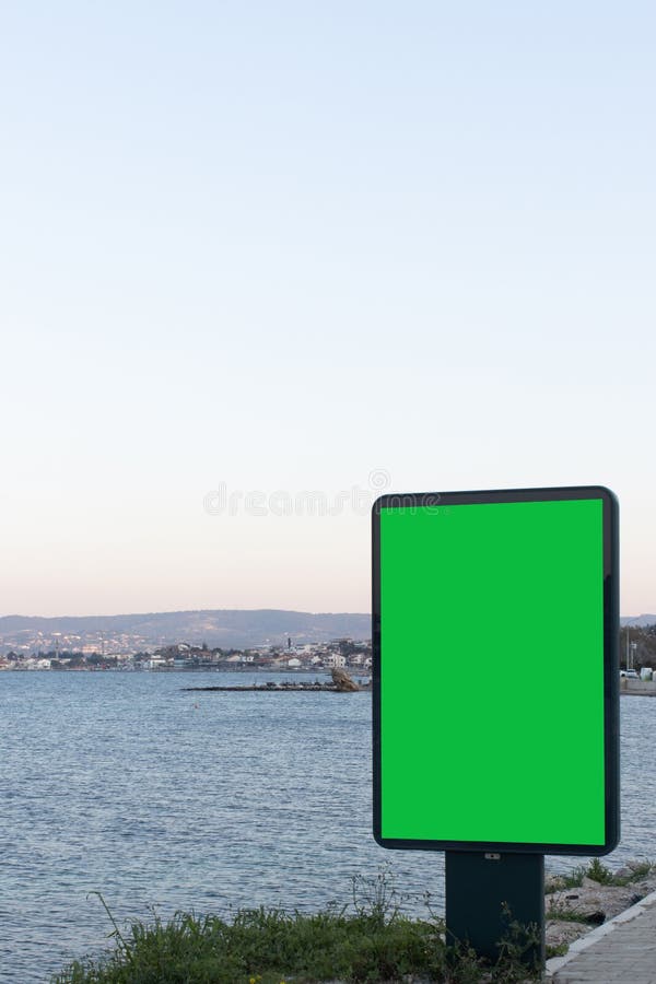 Vertical Image of a Green Screen for Ads with an Ocean View, an ...