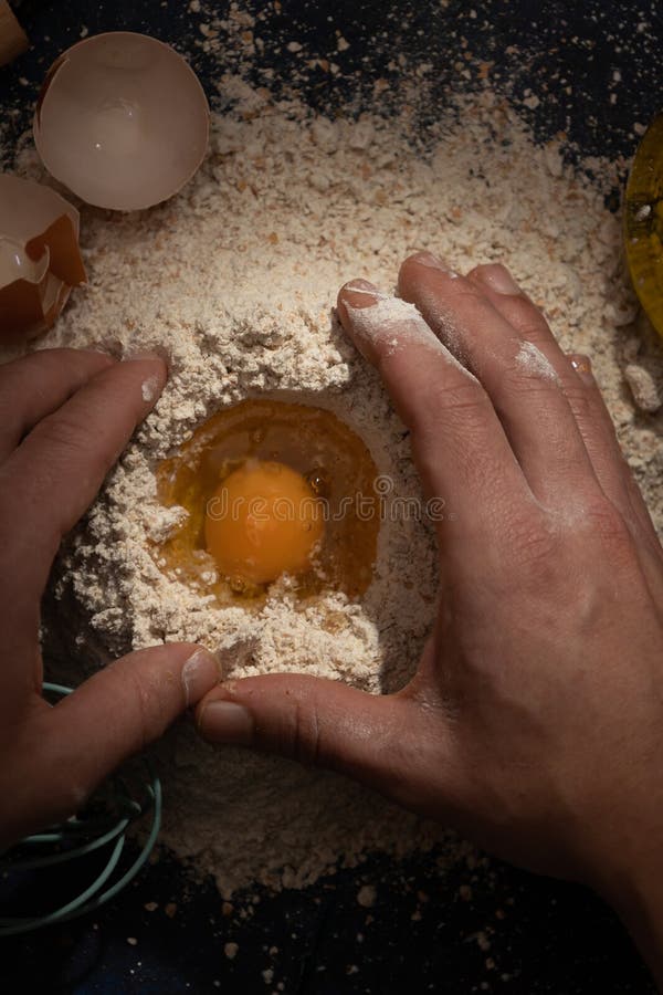 Vertical Image of Male Hands Mixing a Mound of Whole Wheat Flour with ...