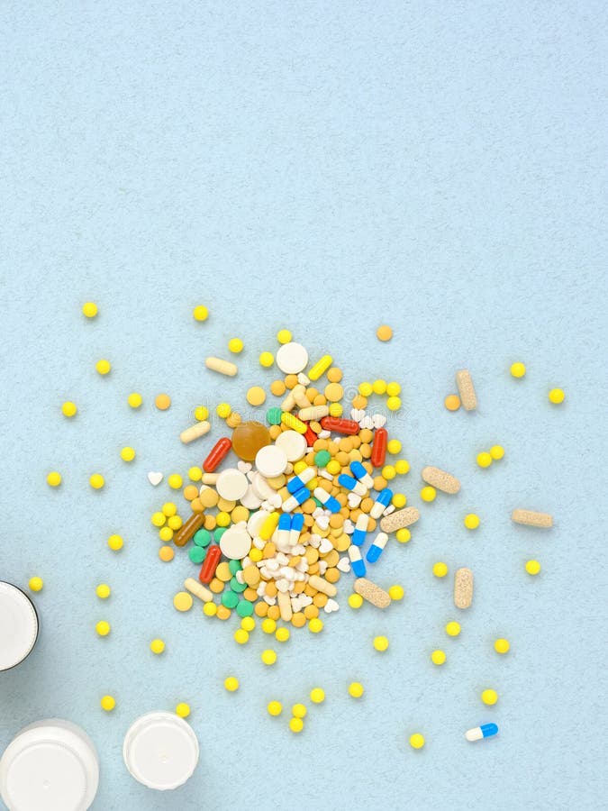 Vertical Image of Many Multi-colored Tablets, Capsules and Pills Stock ...
