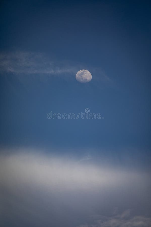 Vertical Image of the Moon in the Daylight Sky with High Cirrus Clouds ...