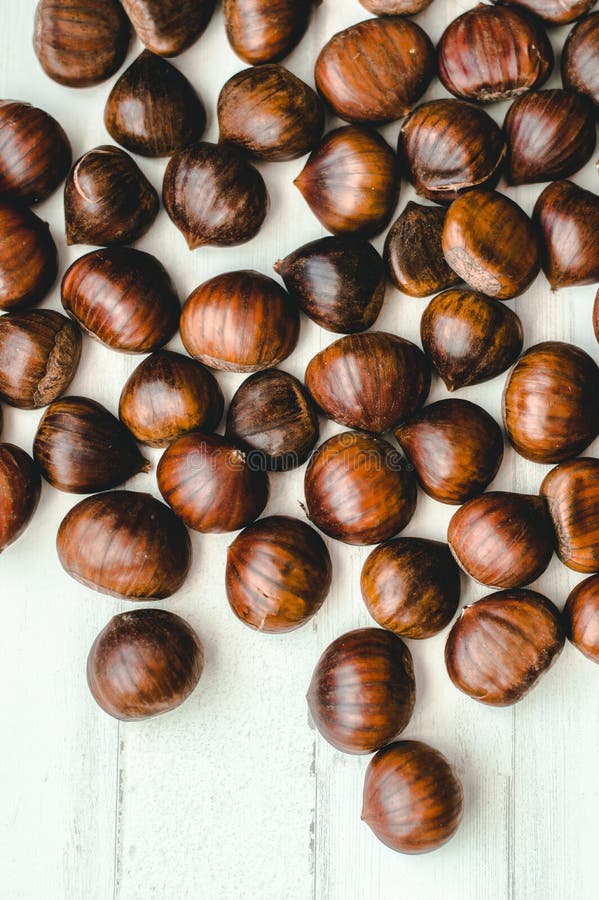 Vertical Image of Raw Chestnuts Thrown on a White Background Stock ...