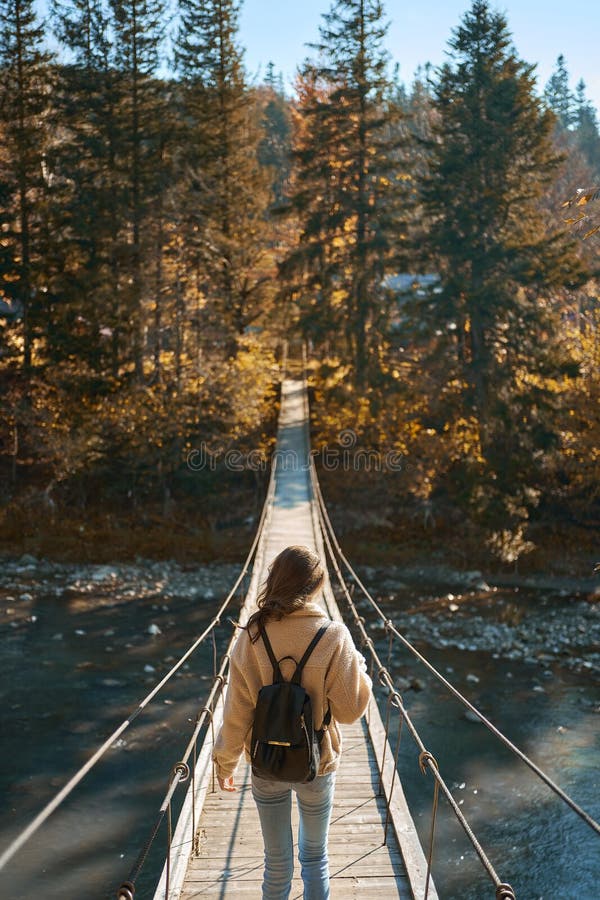 Vertical Image Rear View Walking Backpacker Woman on Hanging Bridge ...