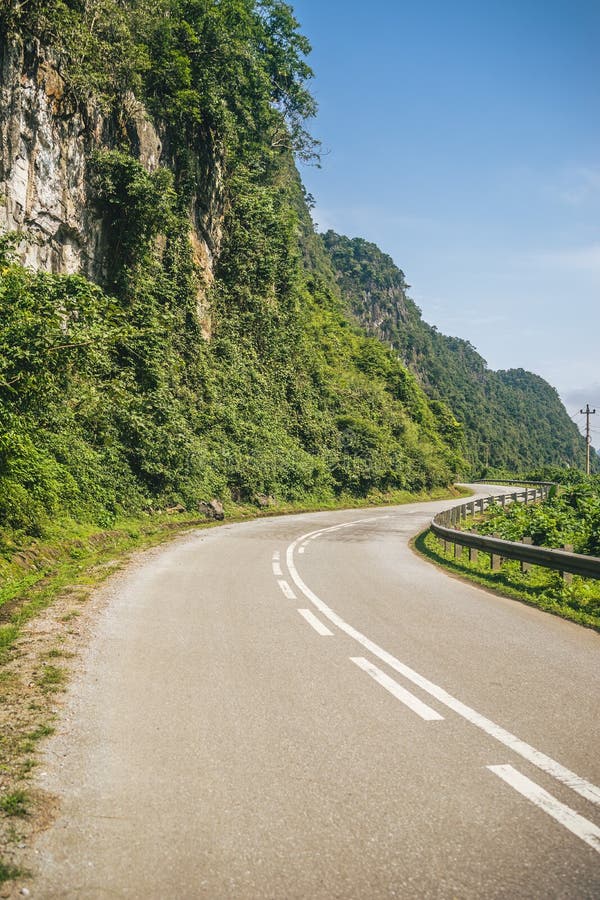Vertical Image of a Road Winding through the Side of a Mountain Stock ...