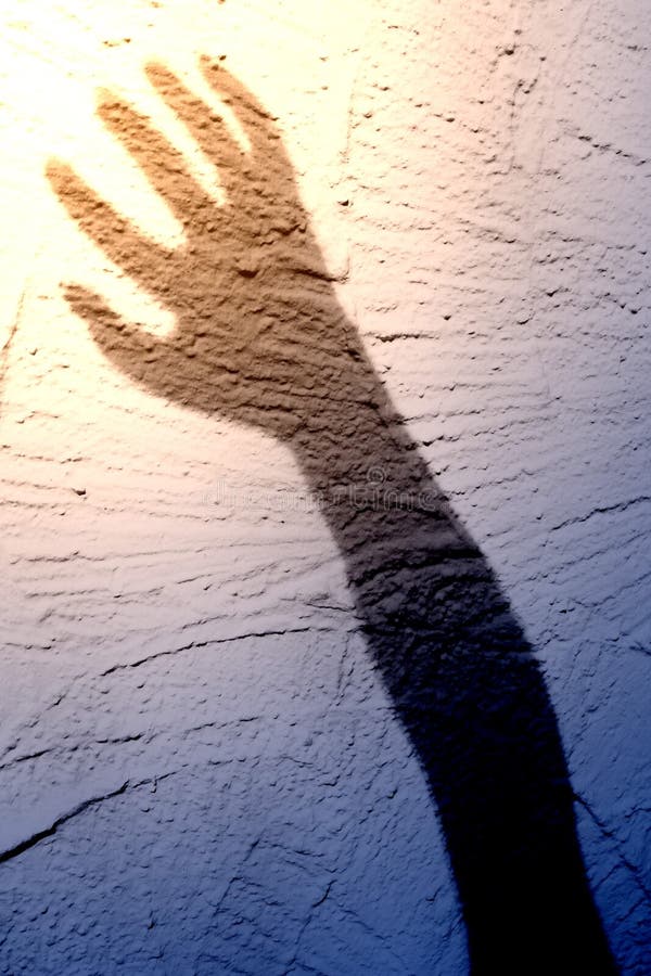 Vertical Image of a Shadow of an Arm Against a White Concrete Wall ...