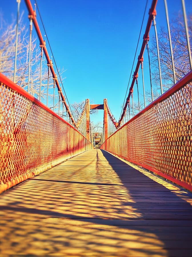 A Vertical Image Showcasing a Modern Bridge with Sunlight Illuminating ...