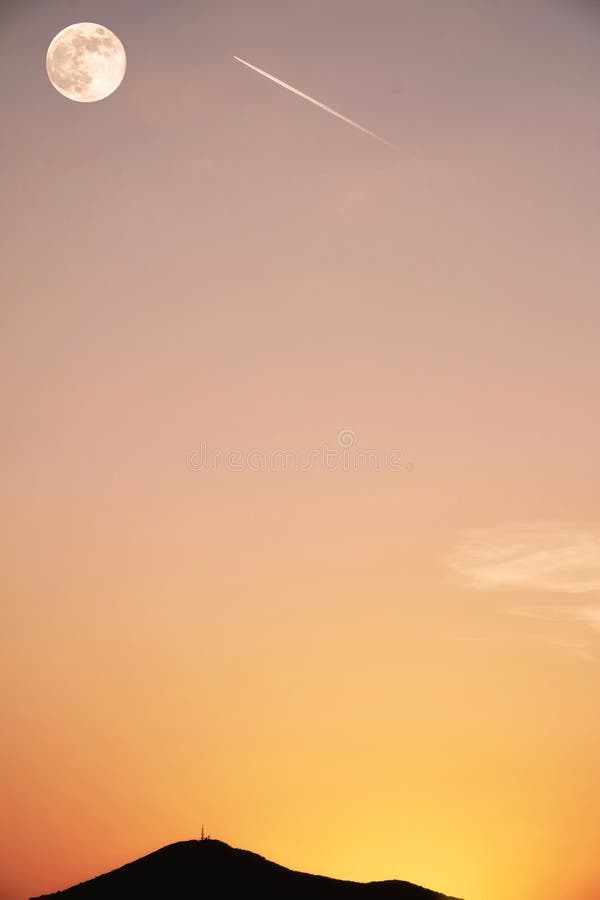 Vertical Image with a Space Shuttle Flying To the Moon in Sunset Lights ...