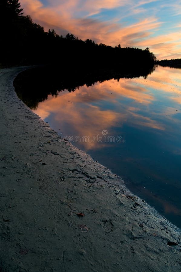 Vertical Image of Sunset Over Lake and Forest Stock Photo - Image of ...