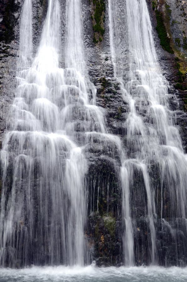 Vertical Image of a Waterfall in a River Stock Image - Image of people ...