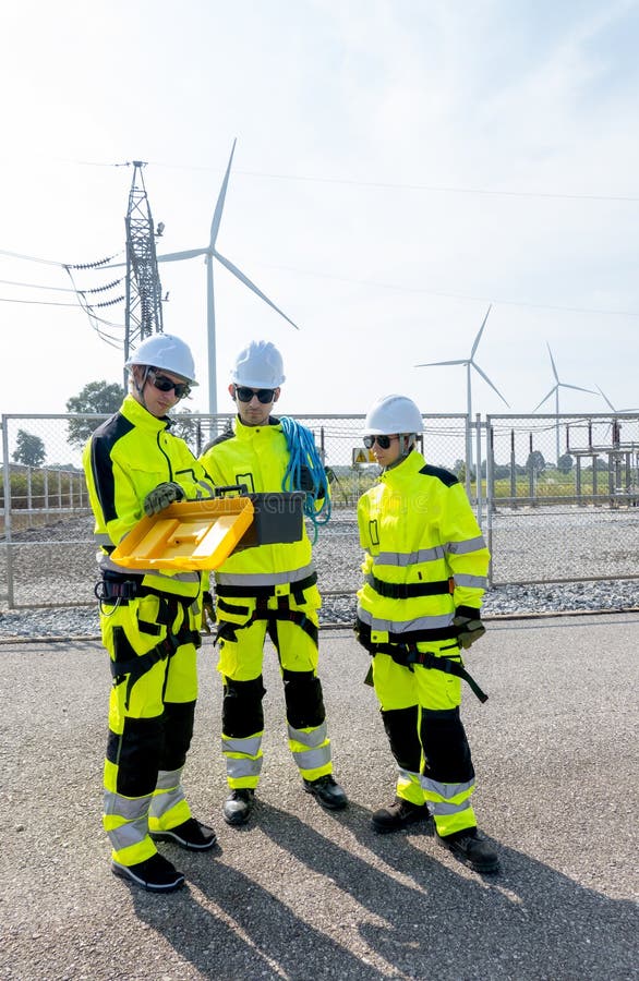 Vertical Image of Wind Turbine or Windmill Workers or Engineers Stay in ...