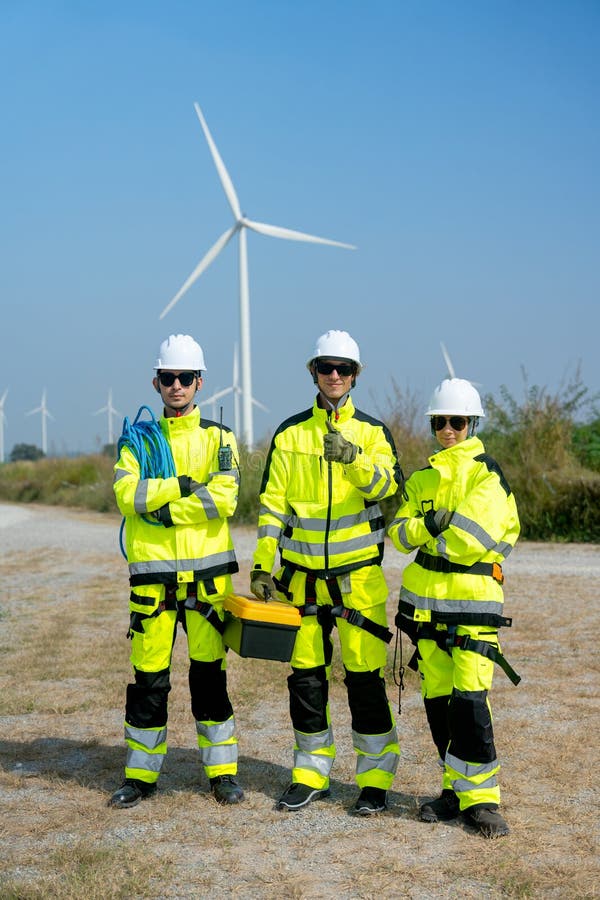 Vertical Image of Wind Turbine or Windmill Workers or Technicians Stand ...