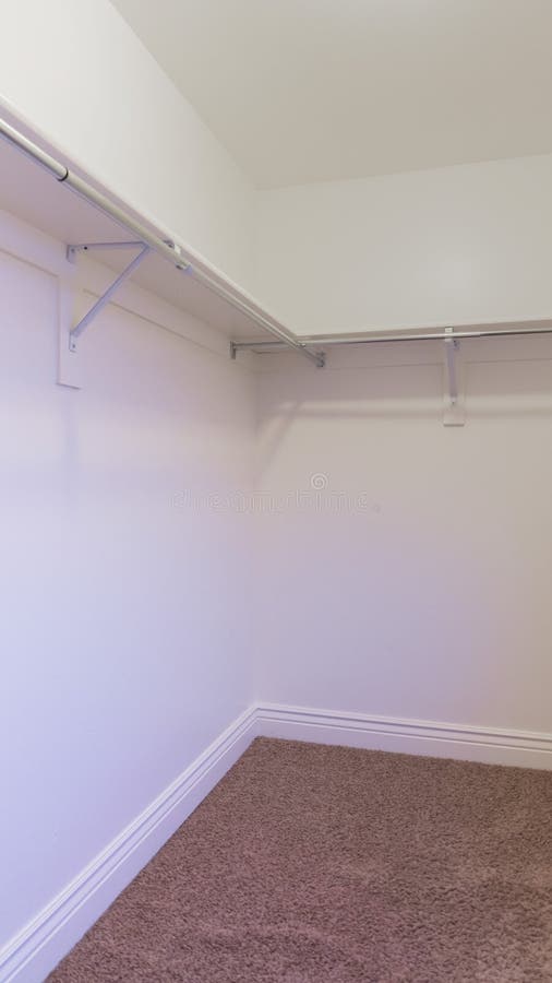 Vertical Interior of Empty Walk-in Wardrobe with Rails Stock Image ...