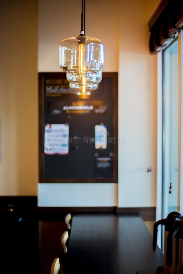 Vertical Interior Shot of a Cafe Lights Hanging from the Ceiling with a ...