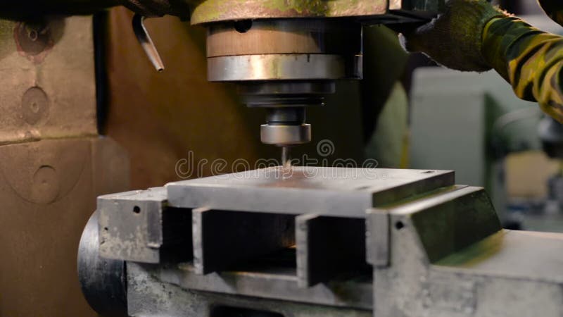 Vertical Knee-type Milling Machine Processes the Metal Workpiece. Stock ...
