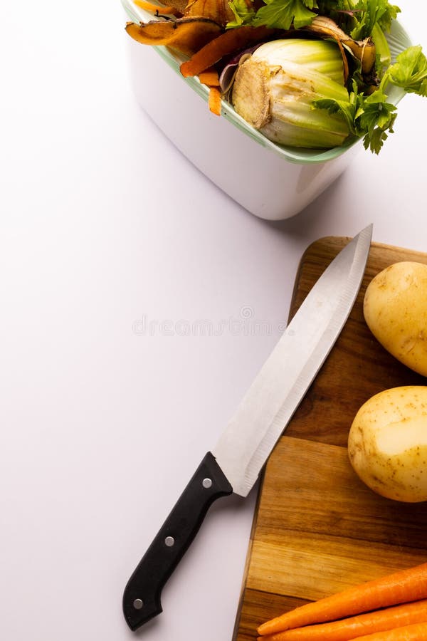 Vertical of Knife and Vegetables on Chopping Board with Vegetable Waste ...