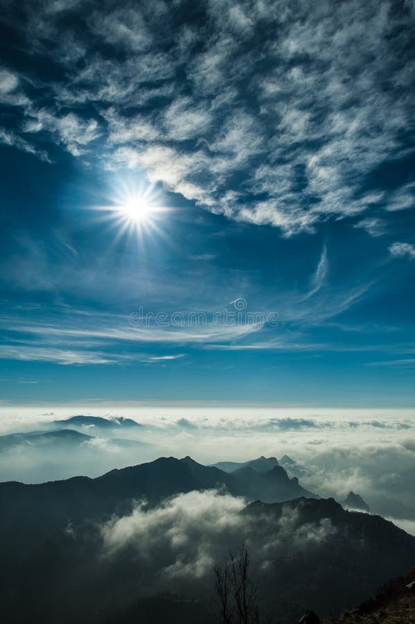 Vertical Landscape of Mountains, Clouds, Sun and Sky Stock Photo ...
