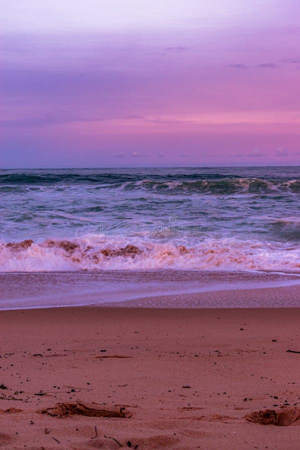 Vertical Landscape Shot of a Beautiful Colorful Sunset at the Beach ...