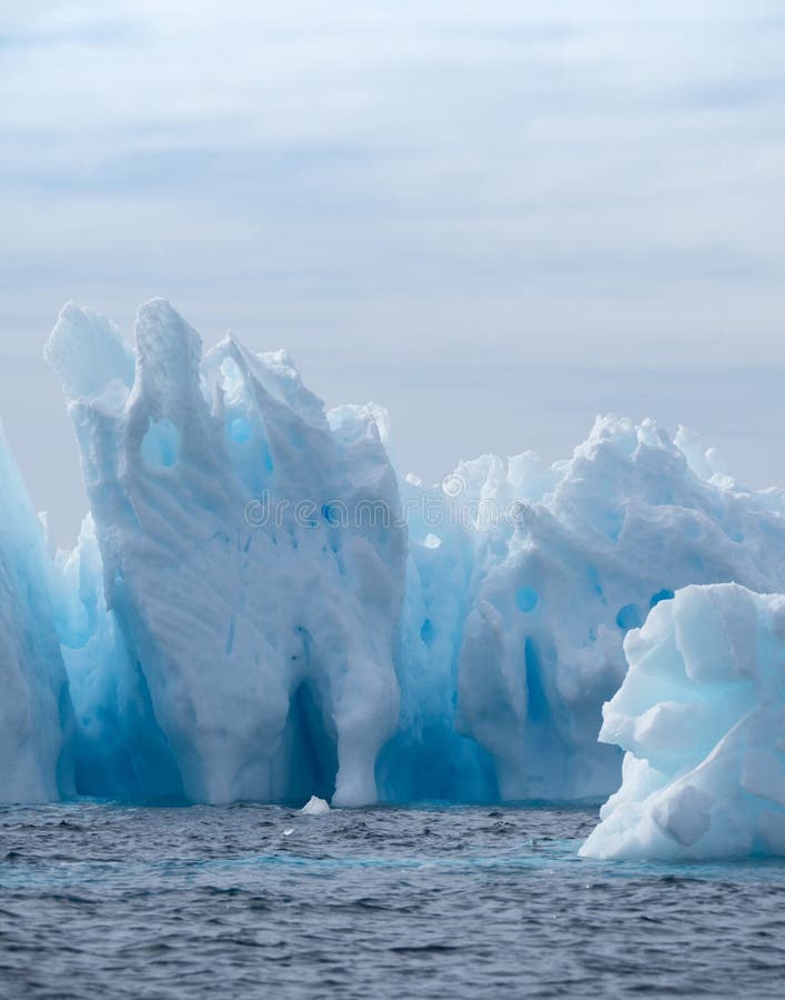 Vertical Light To Dark Blue Iceberg with Windows Stock Photo - Image of ...