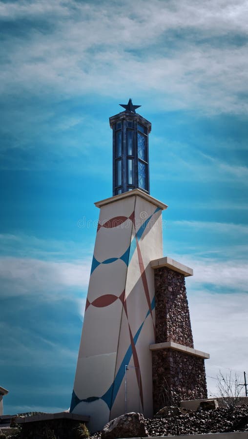 Vertical of a Lighthouse Against a Backdrop of a Blue Cloudy Sky Stock ...