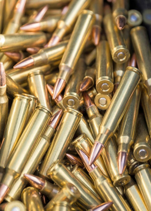 Vertical Loads of Long Sharp Bullets Inside Its Case with a Blue Cloth ...