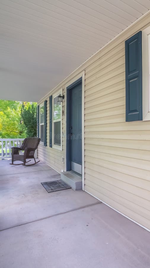 Vertical Long Covered Veranda in Front of a Timber House Stock Image ...