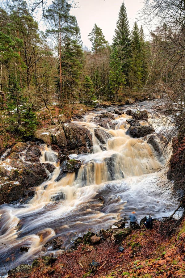 Vertical Long Exposure Shot of the Waterfall Featuring Lush Trees Stock ...