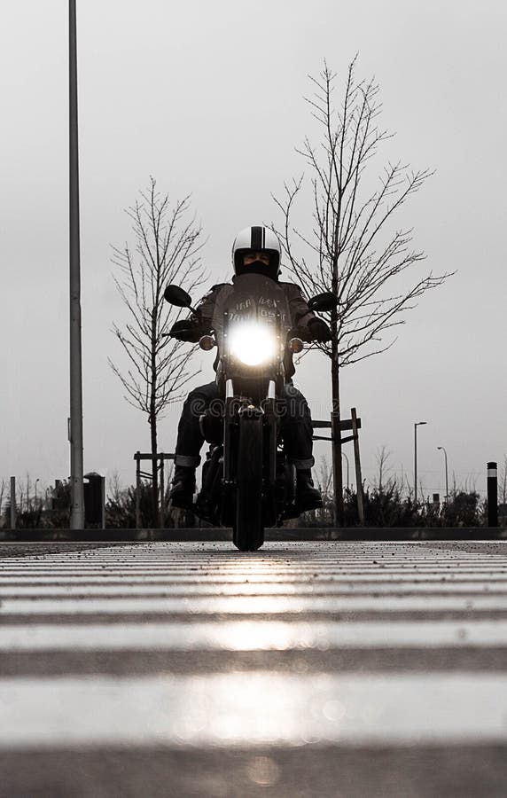 Low Angle of a Motorcycle and Man Sitting on it Stock Image - Image of ...