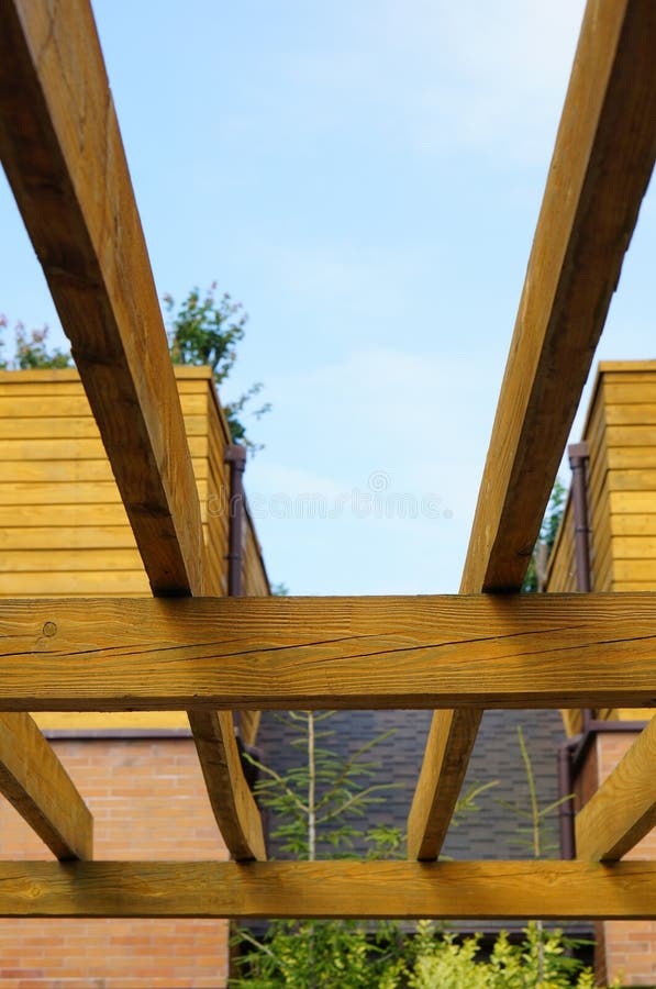 Vertical Low Angle Closeup Shot of Wooden Timber and Posts of a Garden ...