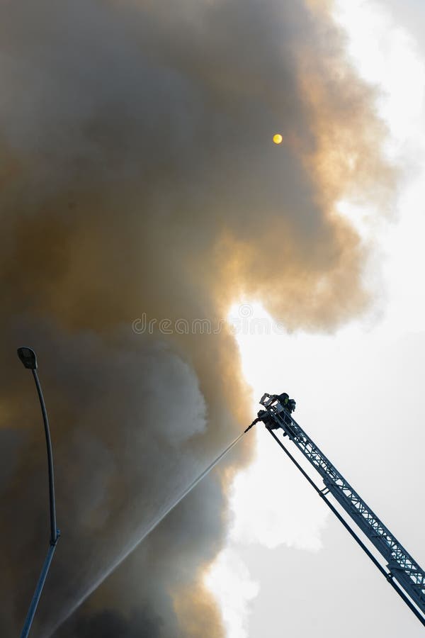 Vertical Low-angle of the Firefighters Blowing the Massive Fire Smoke ...