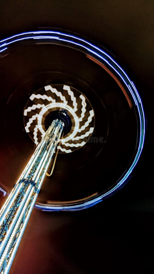 Vertical Low Angle Long Exposure of a Carnival Ride at Night Stock ...