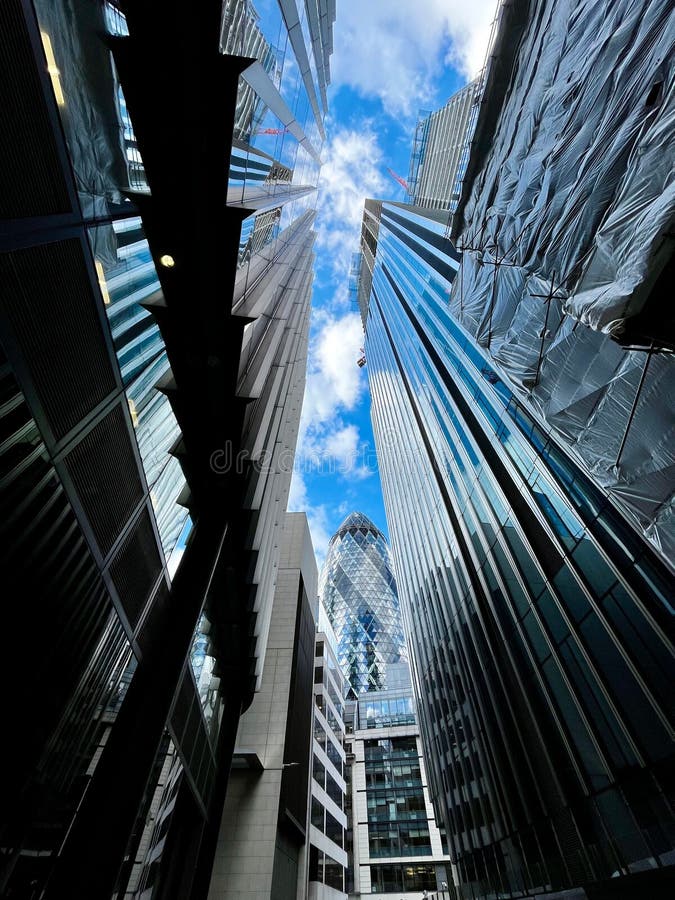 Vertical Low Angle of Modern High-rising Buildings with Clouds in the ...