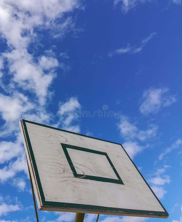 Vertical Low Angle Shot of a Basketball Backboard Under the Cloudy Sky ...