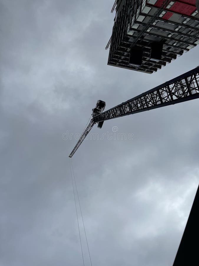 Vertical Low Angle Shot of a Construction Crane during Building Process ...