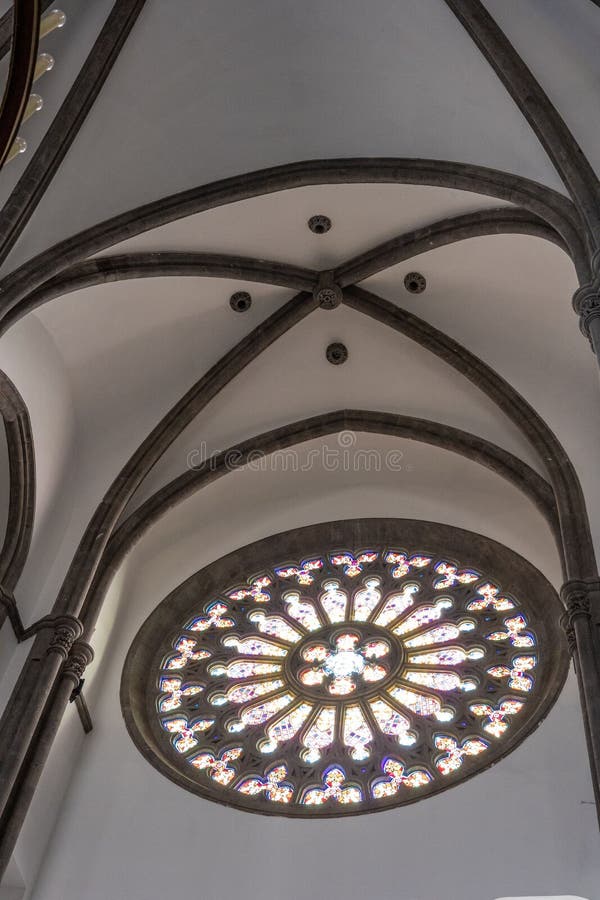 Vertical Low Angle Shot of a Decorative Window from the Inside of a ...