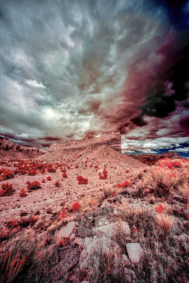 Vertical Low Angle Shot of a Desert Surrounded by Cliffs Under the ...
