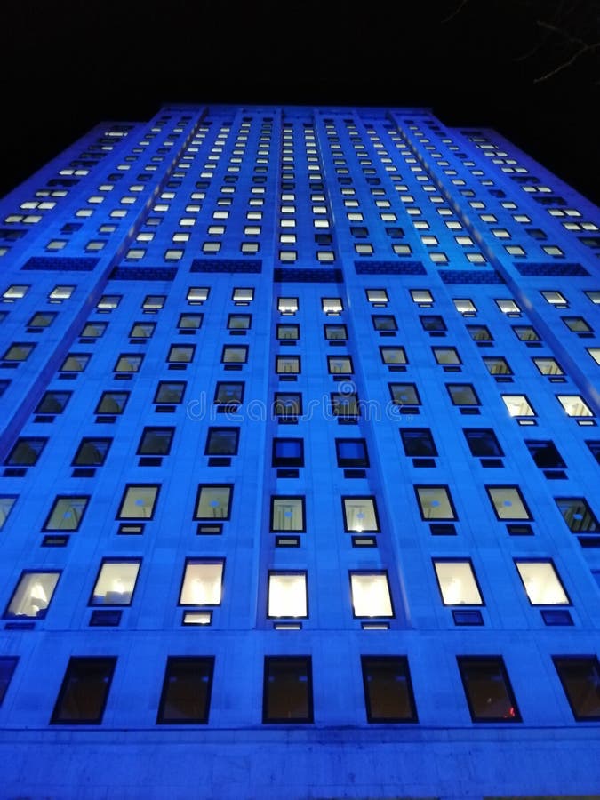 Vertical Low Angle Shot of the Facade of a Skyscraper with Illuminated ...