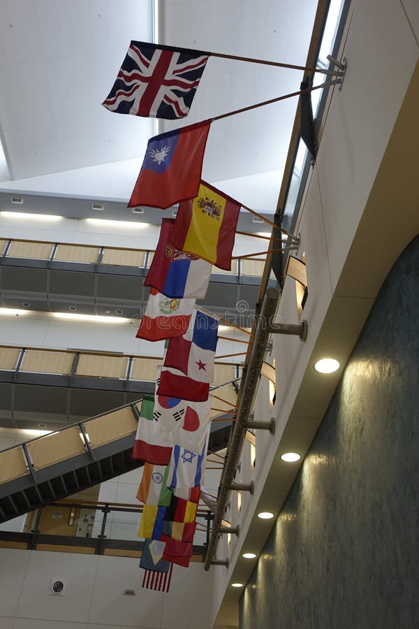 Vertical Low Angle Shot of Flags of Different Countries on Display in a ...