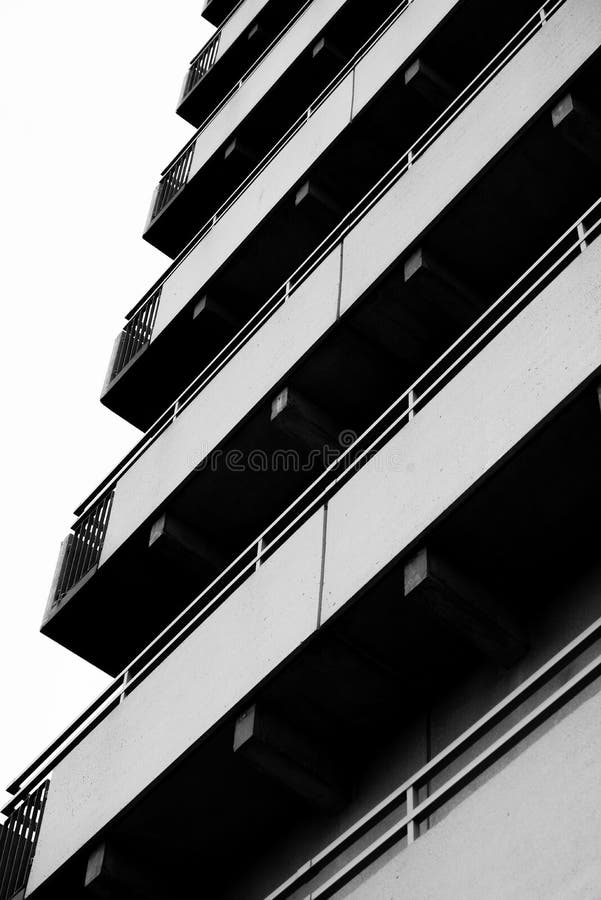 Vertical Low Angle Shot of a Gray Building with Long Balconies Stock ...