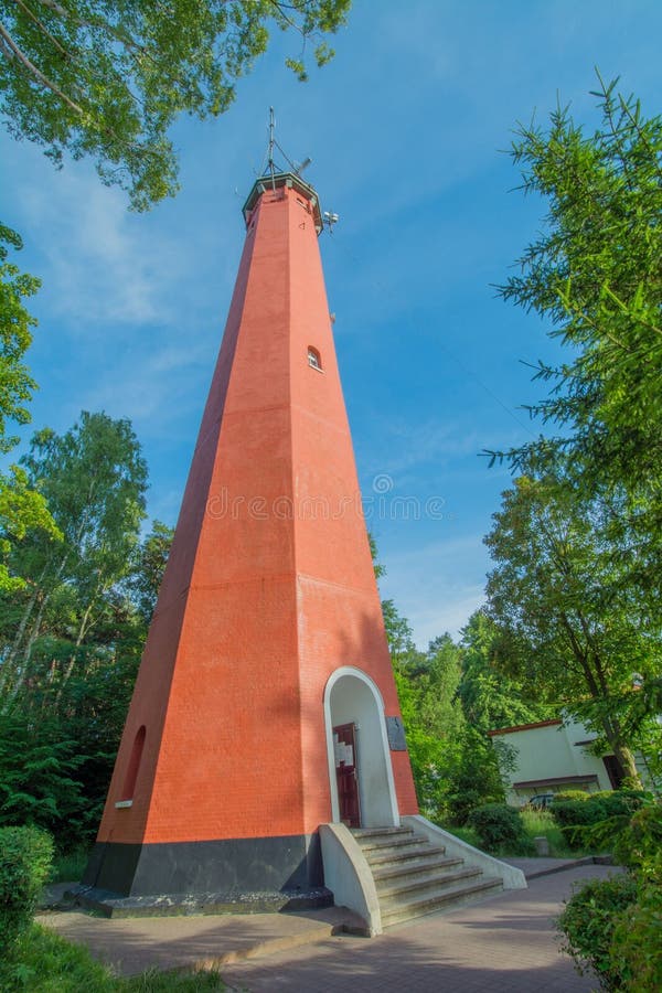 Vertical Low-angle Shot of the Hel Lighthouse with a Cloudy Blue Sky in ...